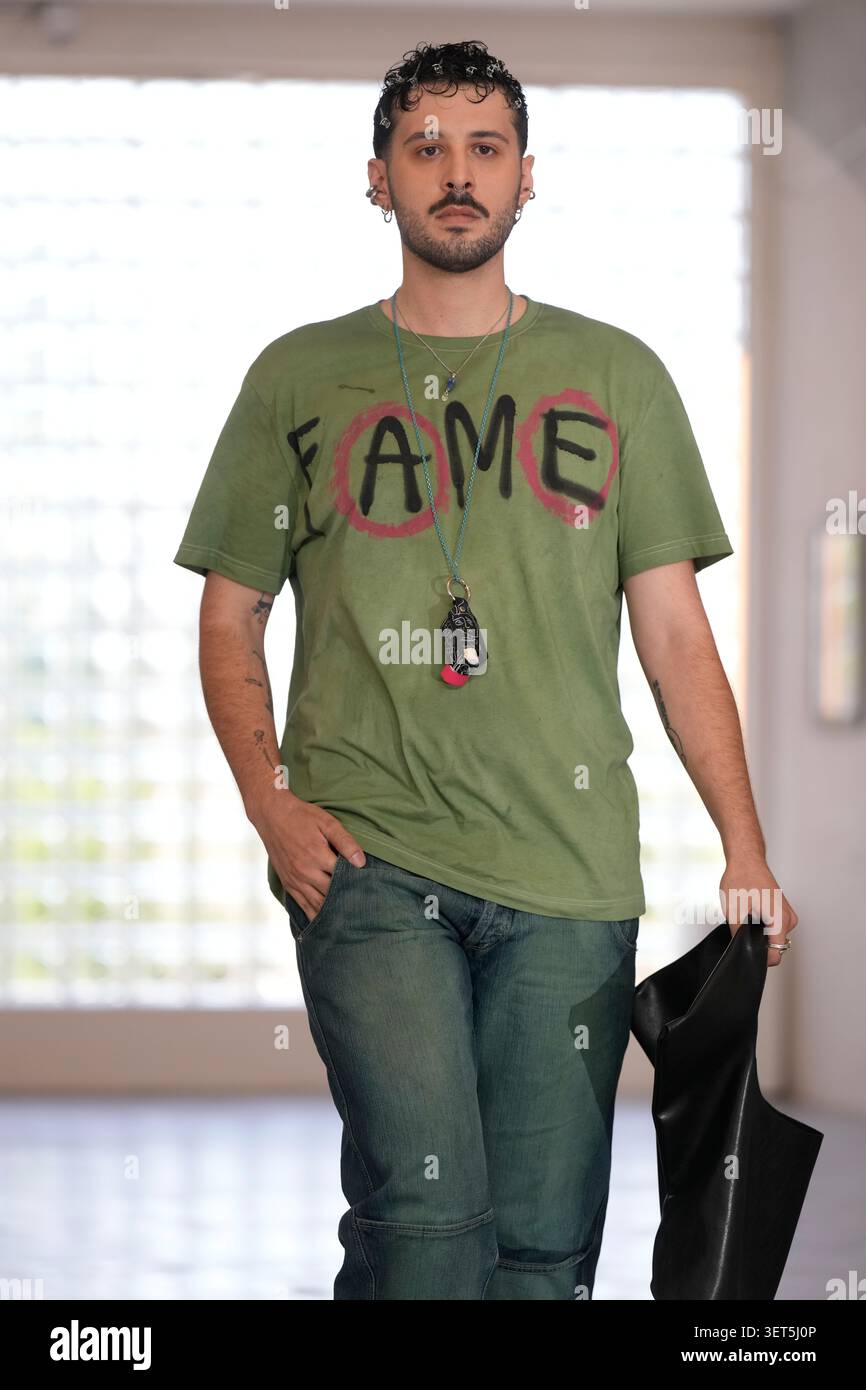 A model wears a creation as part of the Simon Cracker Spring/Summer ...