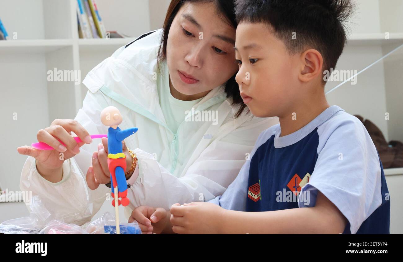 Children make 'Superman Dad' intangible cultural heritage dough ...