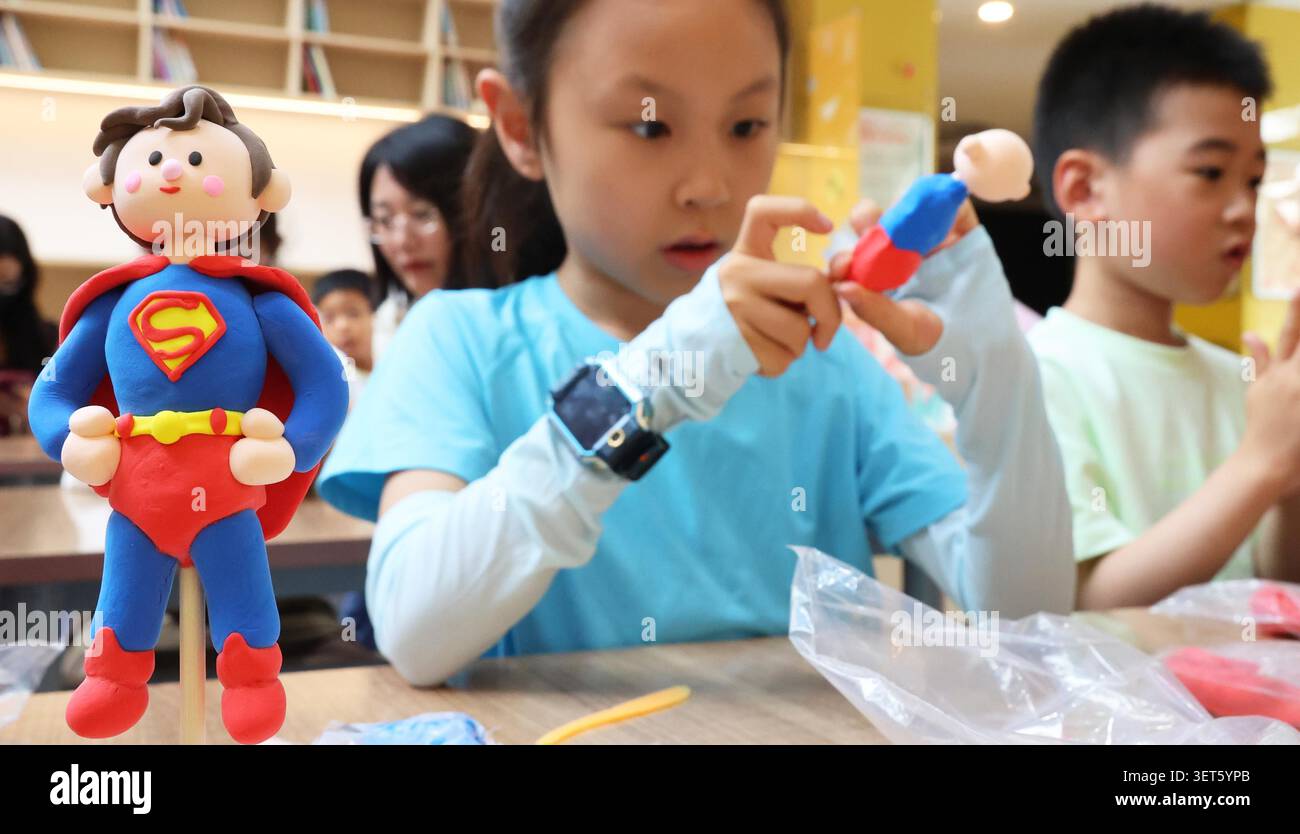 Children make 'Superman Dad' intangible cultural heritage dough ...