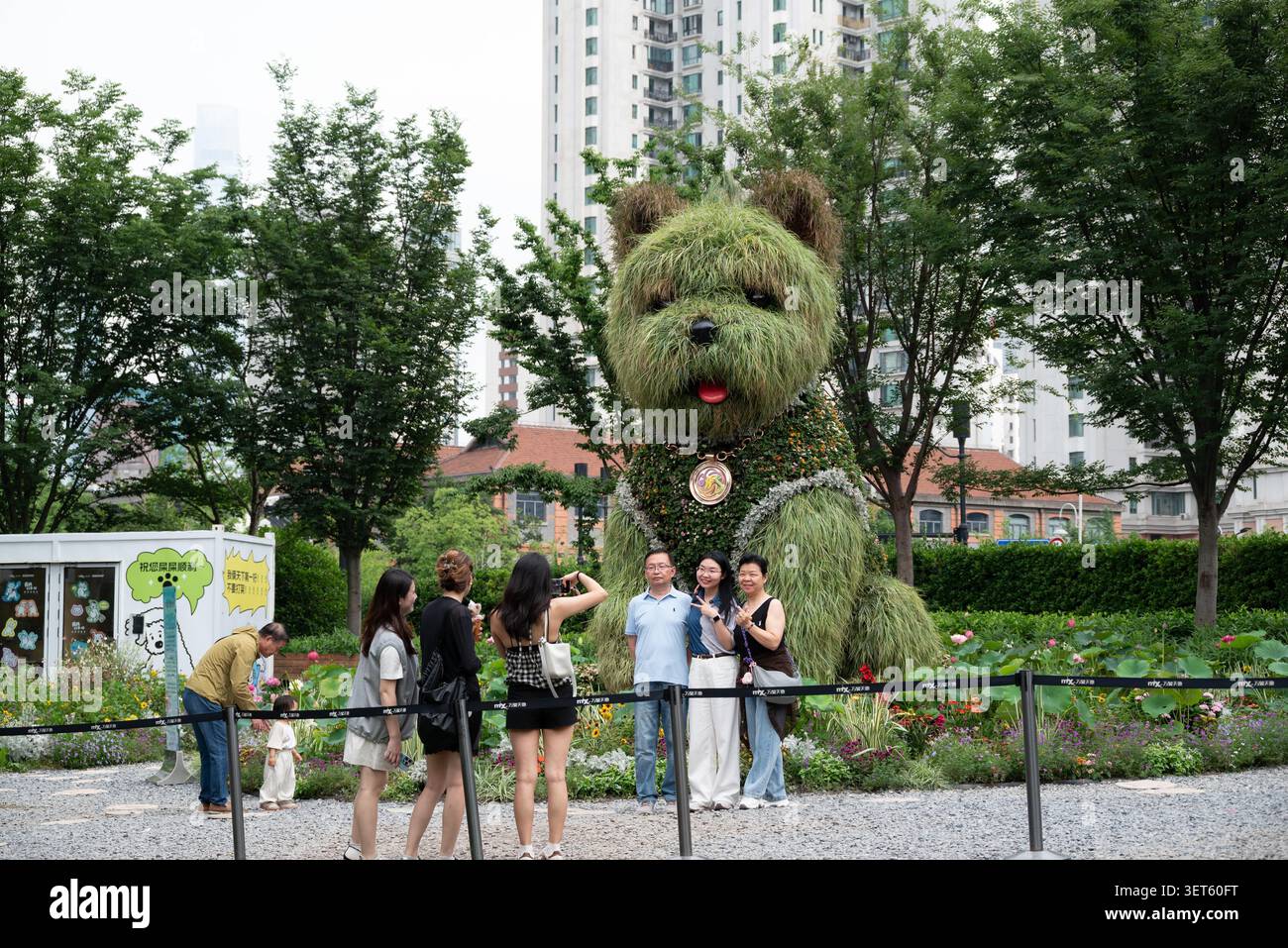 Visitors take photos with the viral 'Shaggy Dog' topiary after its ...