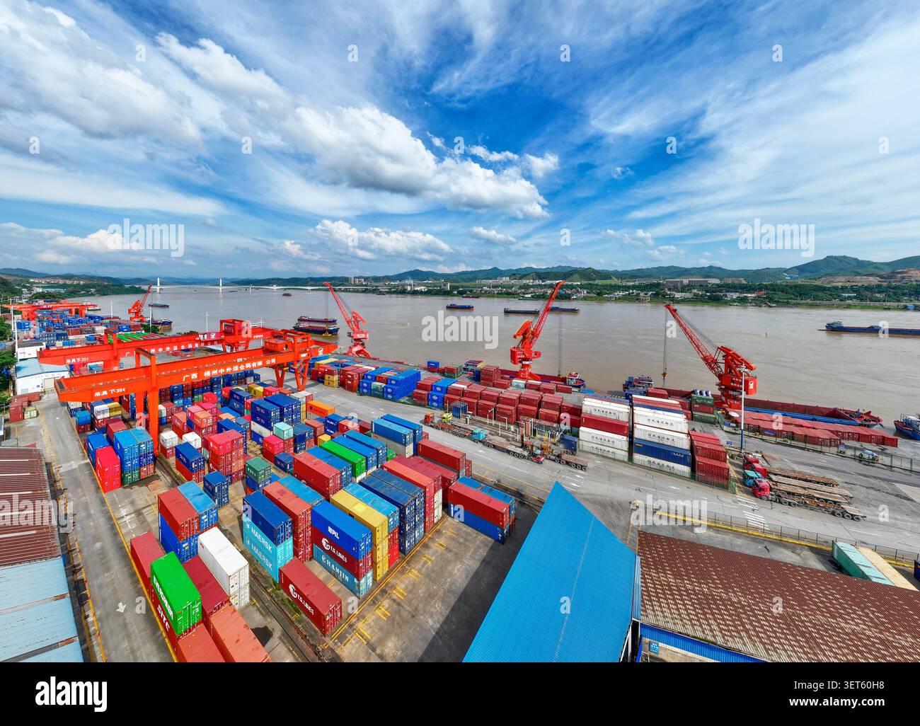 Containers are handled at Lizhuangzhuang Terminal in Wuzhou Port, south ...