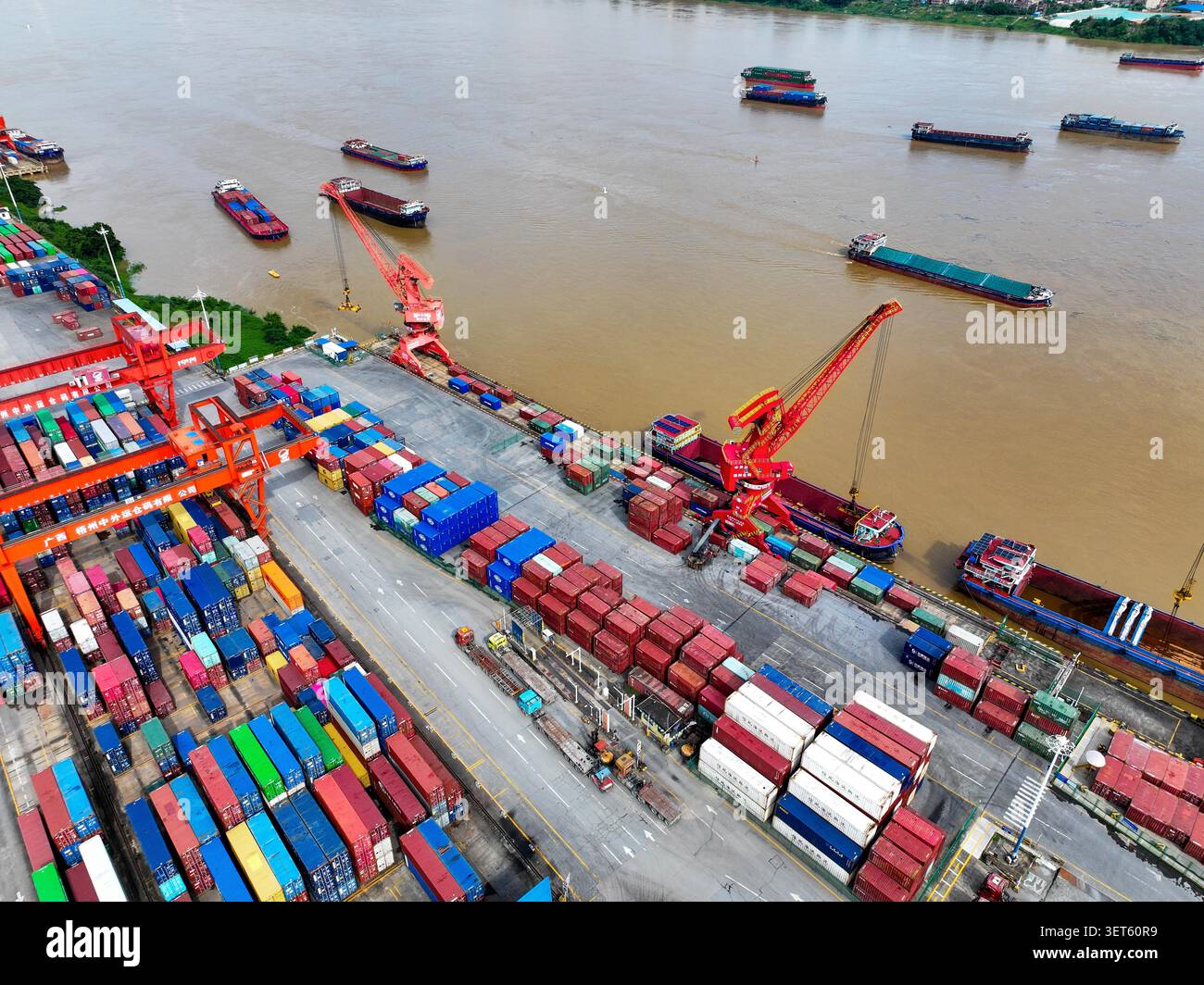Containers are handled at Lizhuangzhuang Terminal in Wuzhou Port, south ...