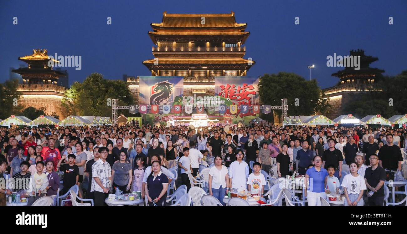 Fans enjoy food while watching the 'Su Super League' match at ...
