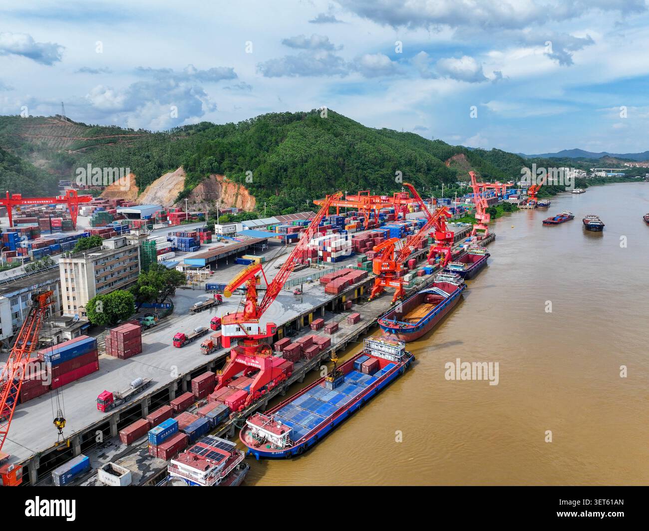 Containers are handled at Lizhuangzhuang Terminal in Wuzhou Port, south ...