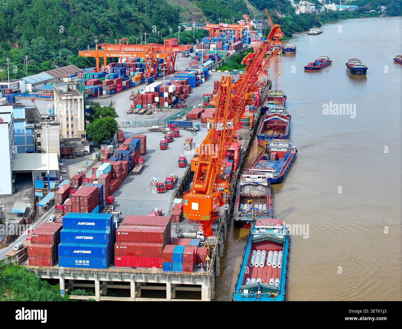 Containers are handled at Lizhuangzhuang Terminal in Wuzhou Port, south ...