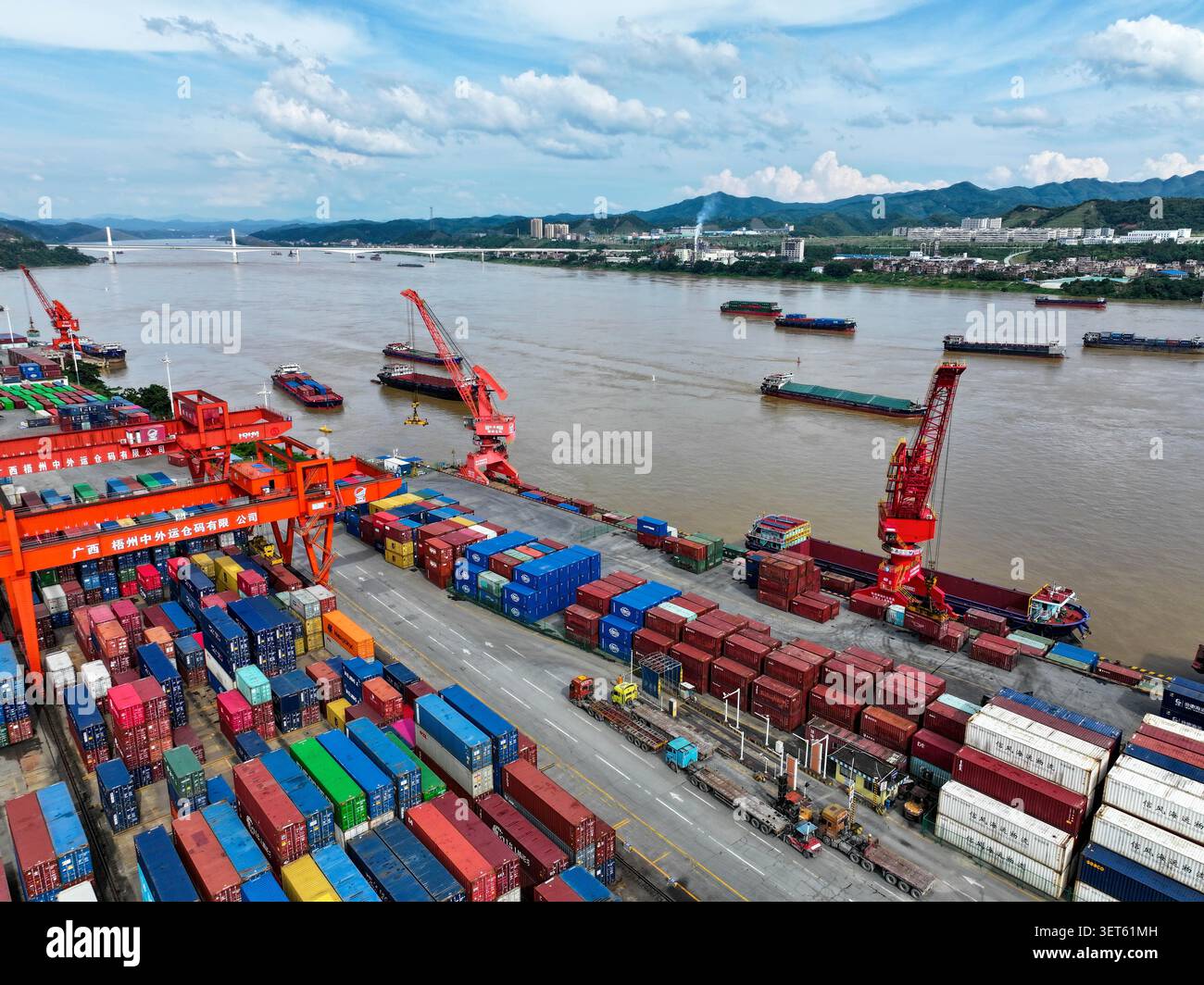Containers are handled at Lizhuangzhuang Terminal in Wuzhou Port, south ...