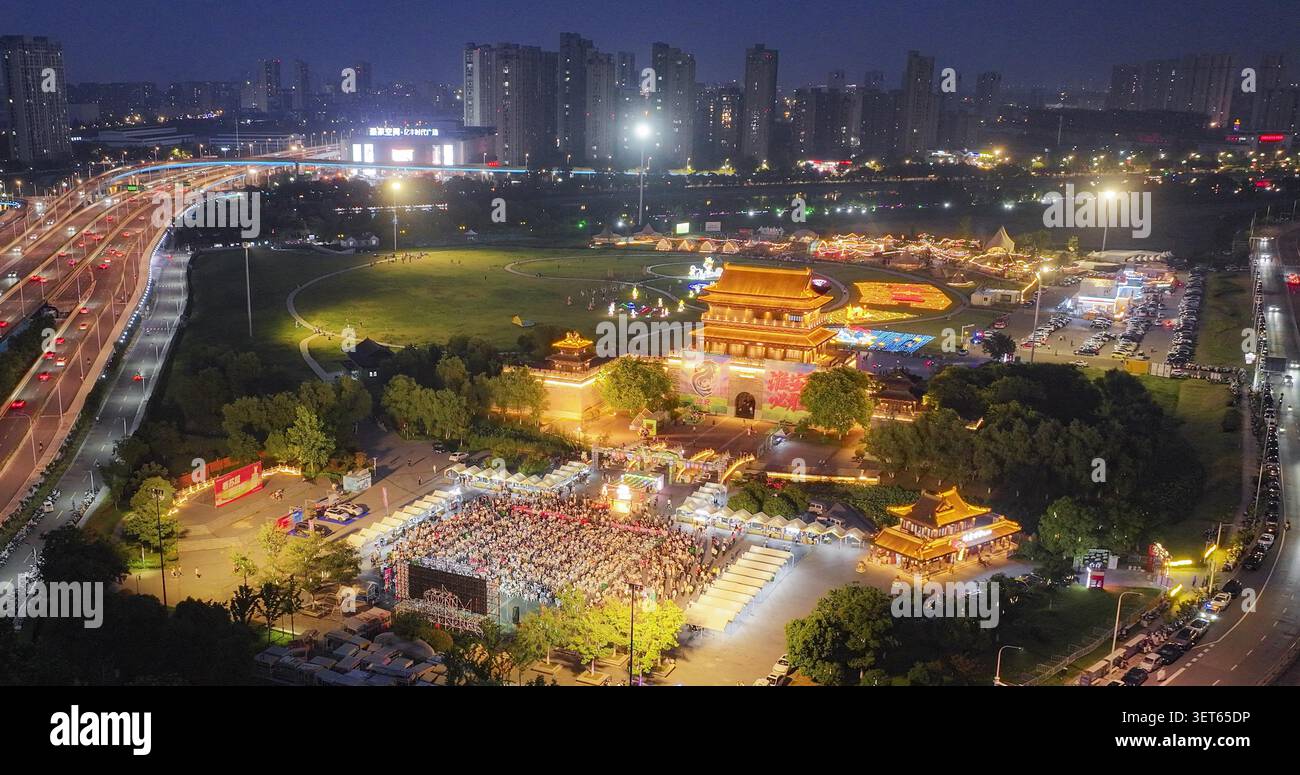 Fans enjoy food while watching the 'Su Super League' match at ...