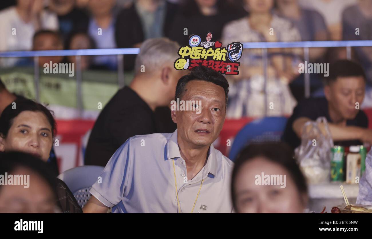 Fans enjoy food while watching the 'Su Super League' match at ...