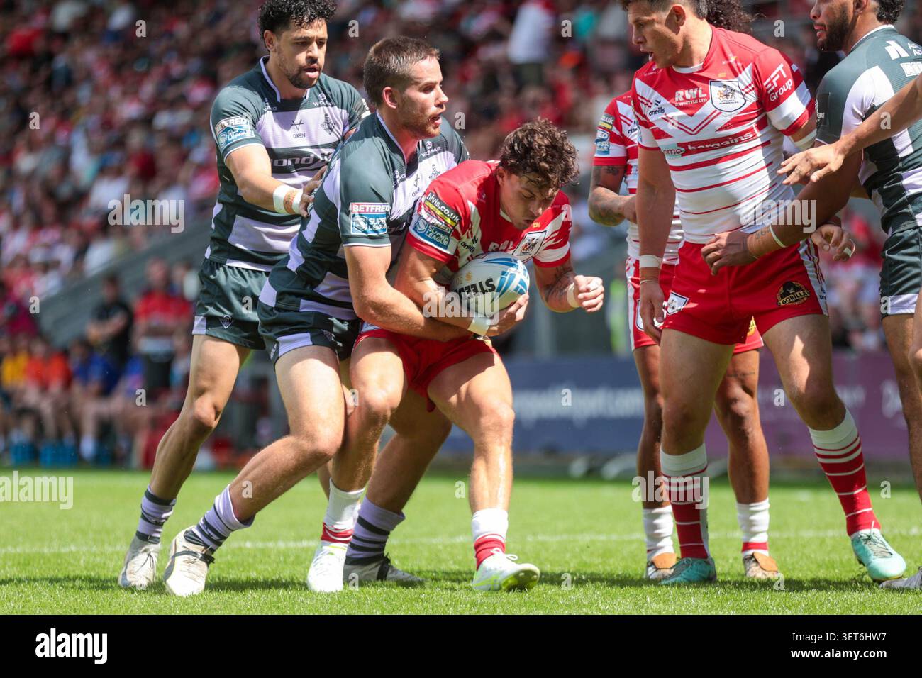 Zane Dunford tackles Owen Dagnall during the BetFred Super League match ...