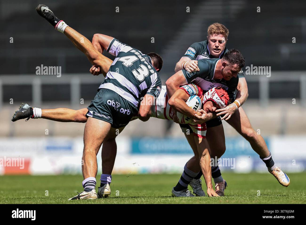 Zane Dunford Zac Woolford and Fenton Rogers tackle Harry Robertson ...