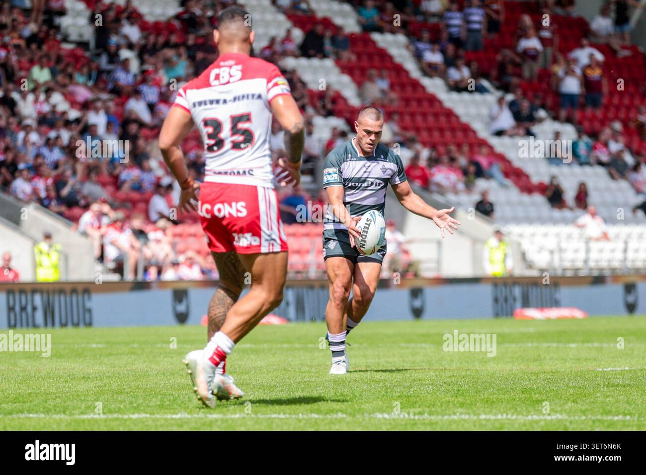 Tui Lolohea puts a crossfield kick in during the BetFred Super League ...