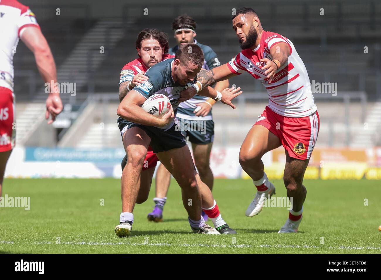 Zane Dunfprd is tackled by St Helens during the BetFred Super League ...