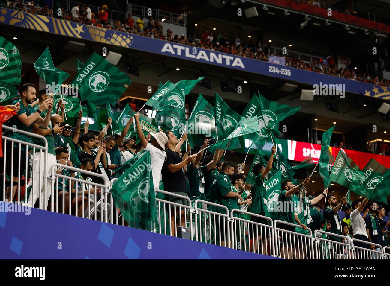 Saudi Arabia fans wave flags in the stands prior to the World Cup Group ...