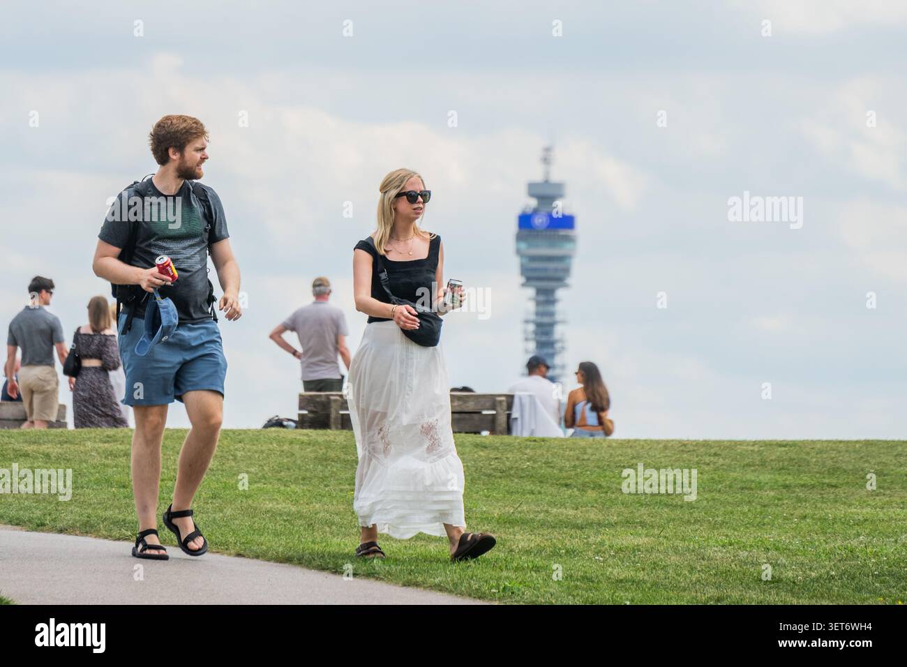 People enjoy the hot sunny weather as the latest heatwave approaches on ...