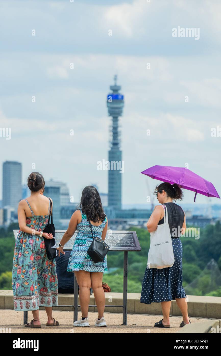 Some strip off to sunbathe others use umbrellas as parasols to provide ...