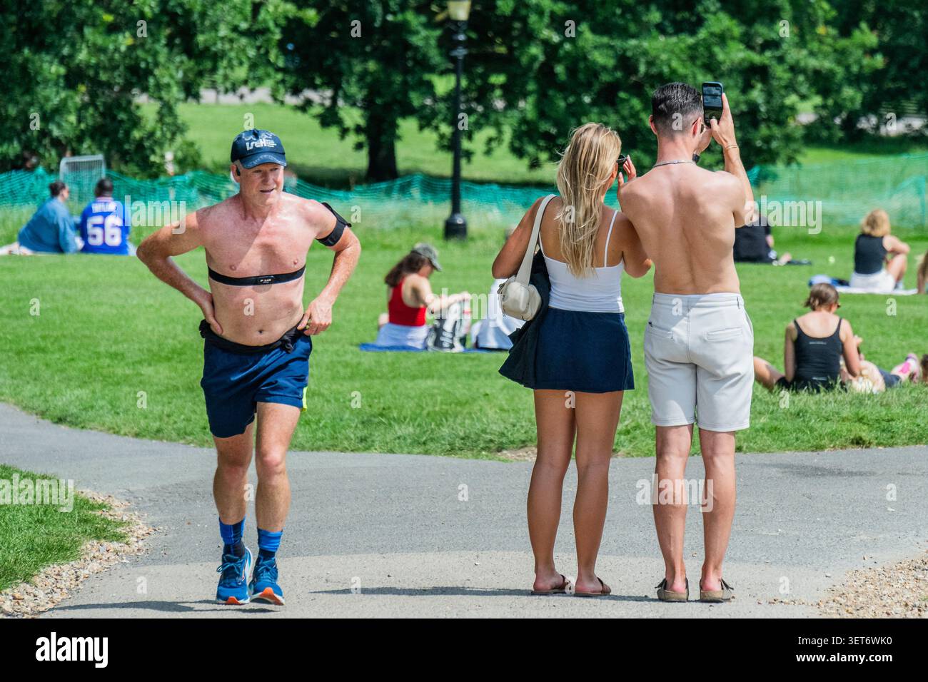 Some strip off to sunbathe others use umbrellas as parasols to provide ...