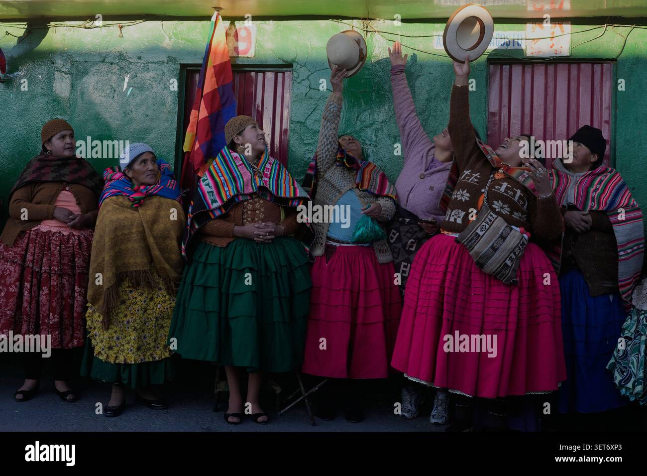 Aymara Indigenous people raise their hands to receive the first rays of ...