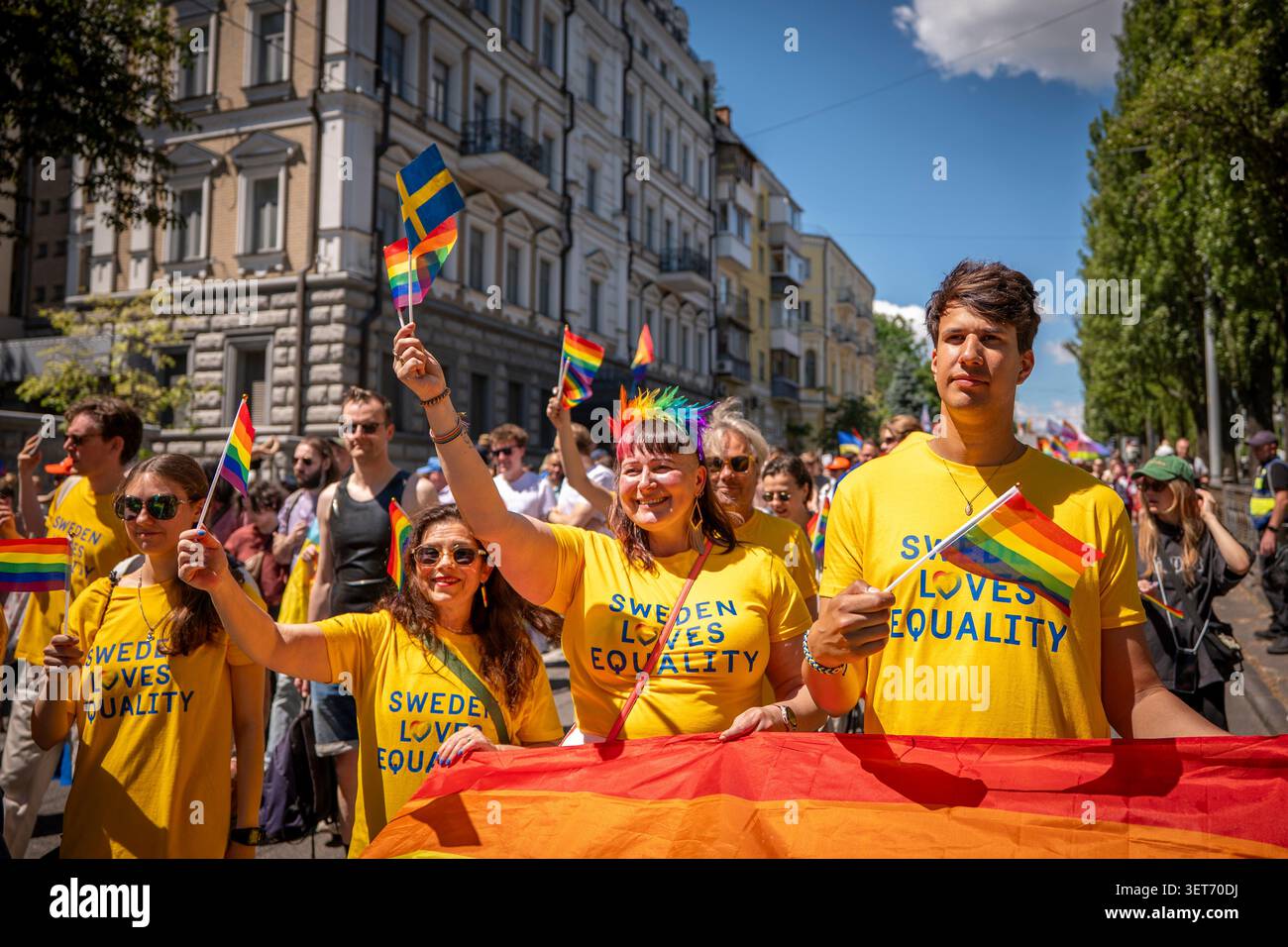Participants wearing matching yellow T-shirts bearing the slogan ...