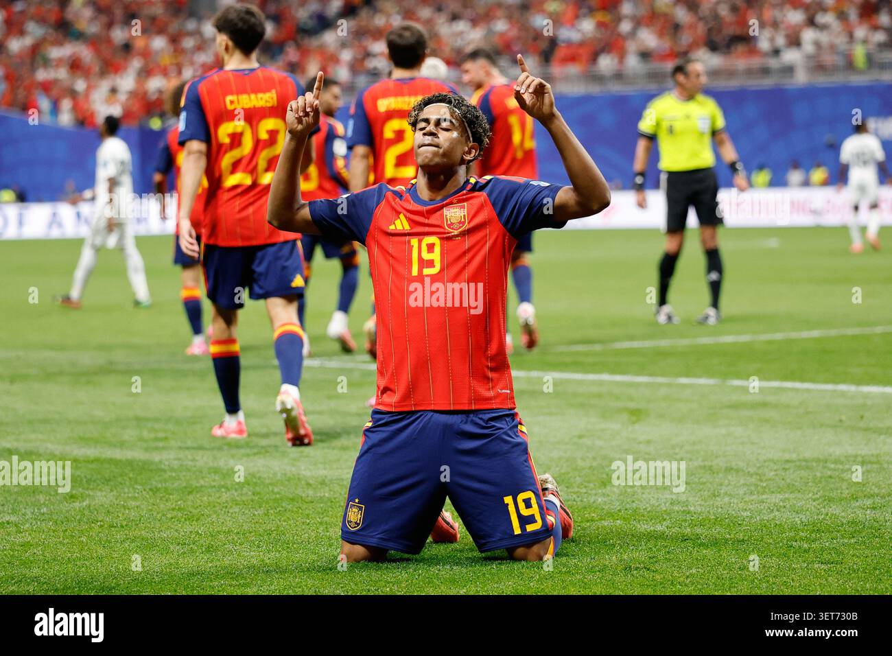 Spain's Lamine Yamal celebrates after scoring his side's opening goal ...