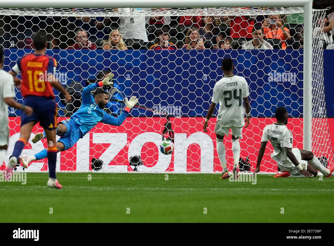 Saudi Arabia goalkeeper Mohammed Alowais fails to stop the opening goal ...