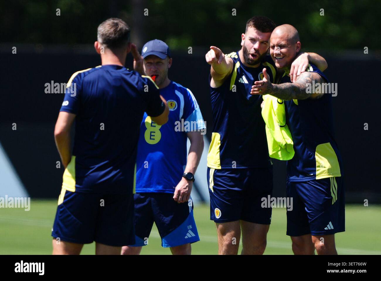 Scotland's Grant Hanley (second right) and Lyndon Dykes during a ...