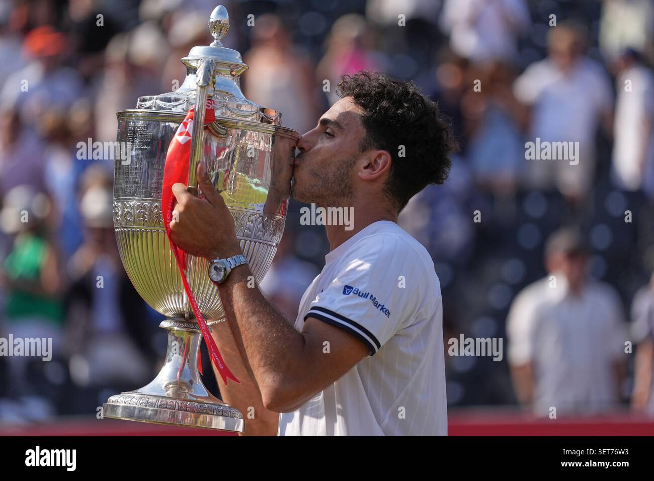 Francisco Cerundolo of Argentina kisses the trophy after winning the ...