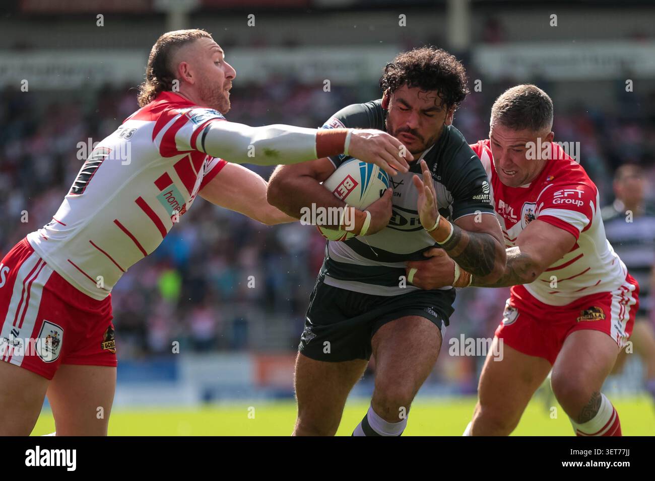 Matthieu Cozza is tackled by St Helens defenders during the BetFred ...