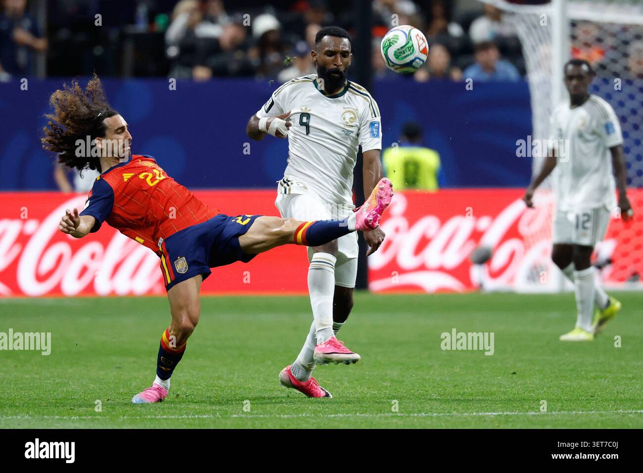 Spain's Marc Cucurella, left, and Saudi Arabia's Feras Albrikan vie for ...