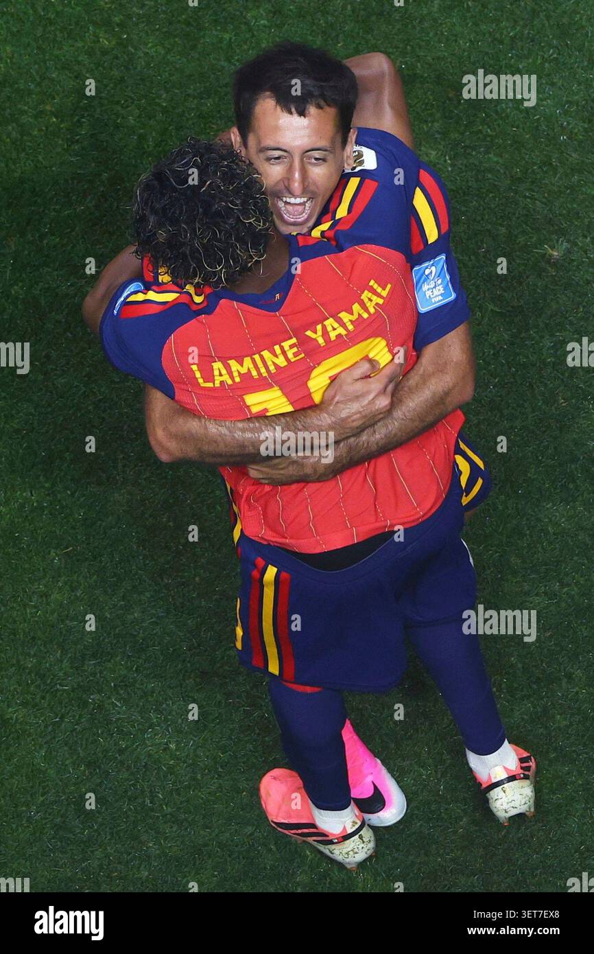 Spain's Lamine Yamal (19) celebrates with Mikel Oyarzabal after scoring ...