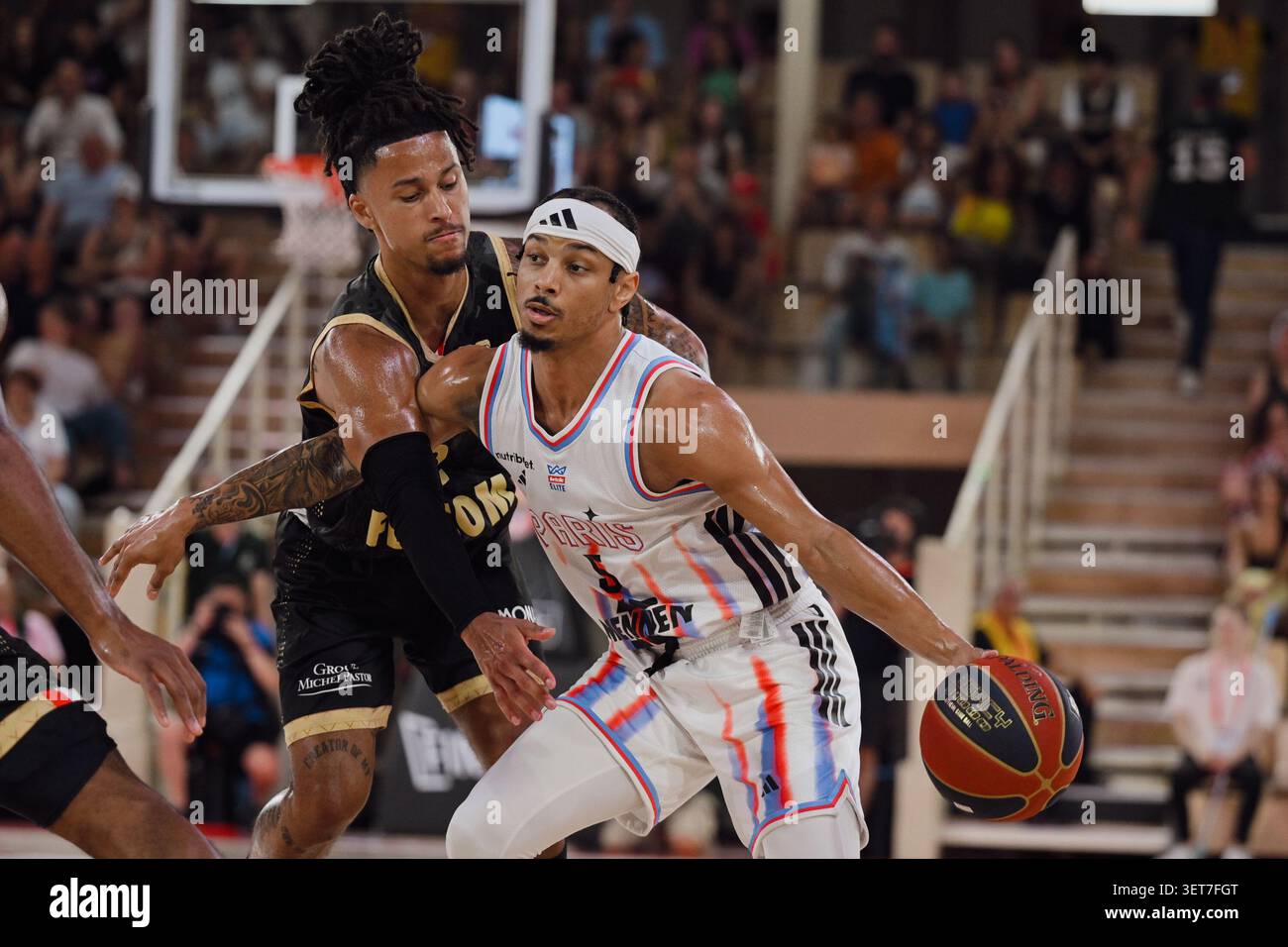 Paris's guard #5 Justin Robinson and Monaco's guard #32 Matthew Strazel ...