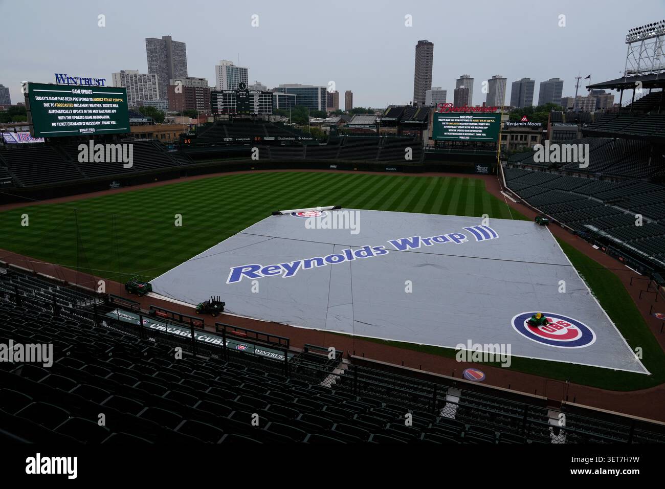 A tarp covers the infield after today's baseball game between the ...