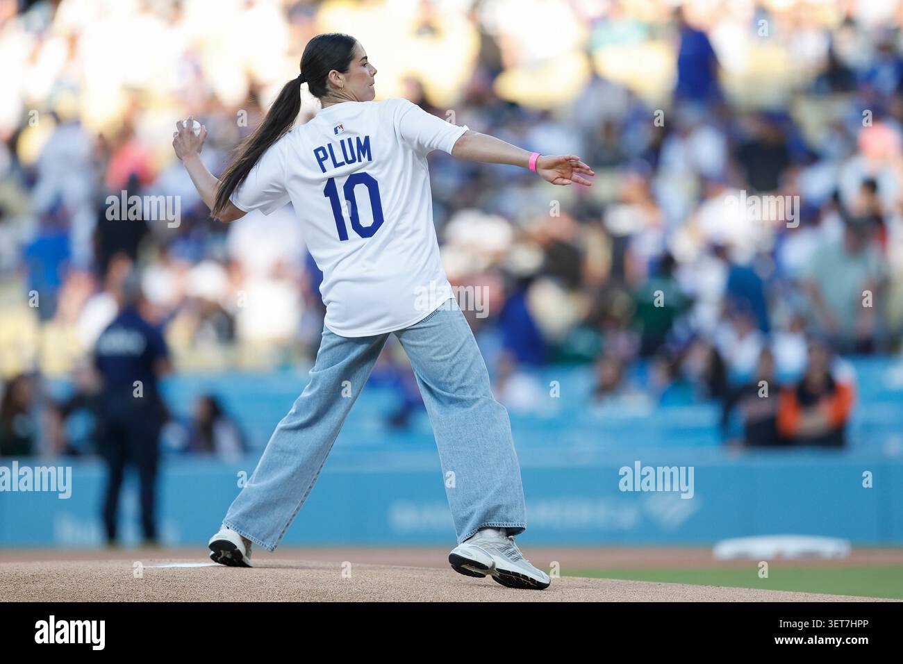 Los Angeles Sparks player Kelsey Plum throws out the ceremonial first ...