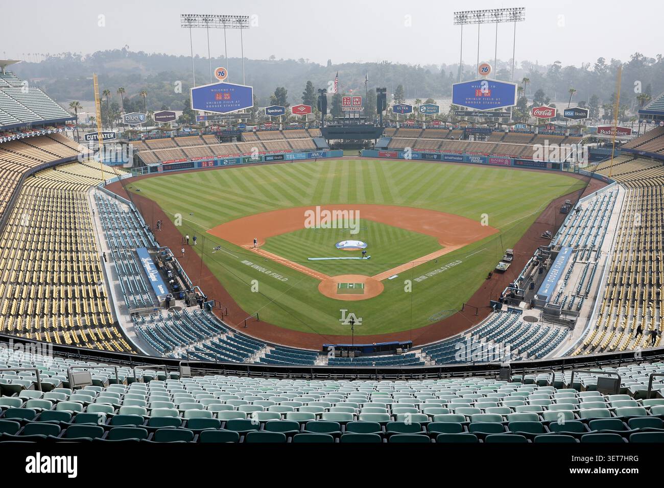 Dodger Stadium is shrouded in haze due to smoke from a warehouse fire ...
