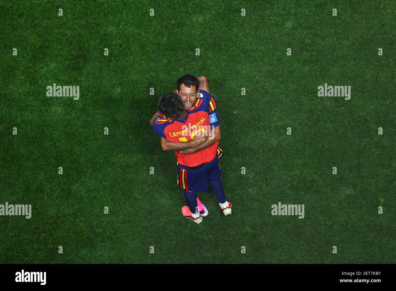 Spain's Lamine Yamal (19) celebrates with Mikel Oyarzabal after scoring ...