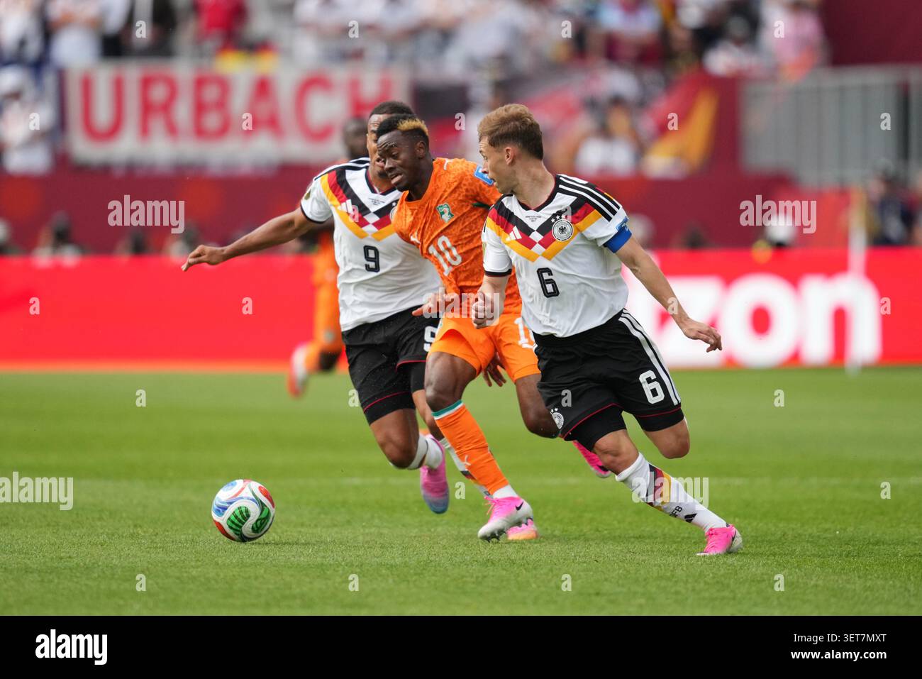 Simon Adingra (Ivory Coast) and Joshua Kimmich (Germany) battle for the ...