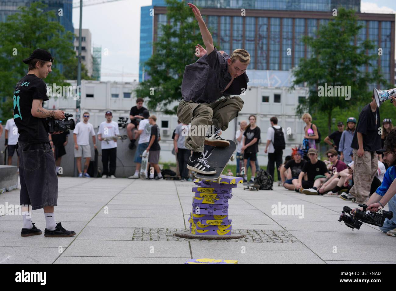 Skateboarders are seen in central Warsaw, Poland on 21 June, 2026 ...