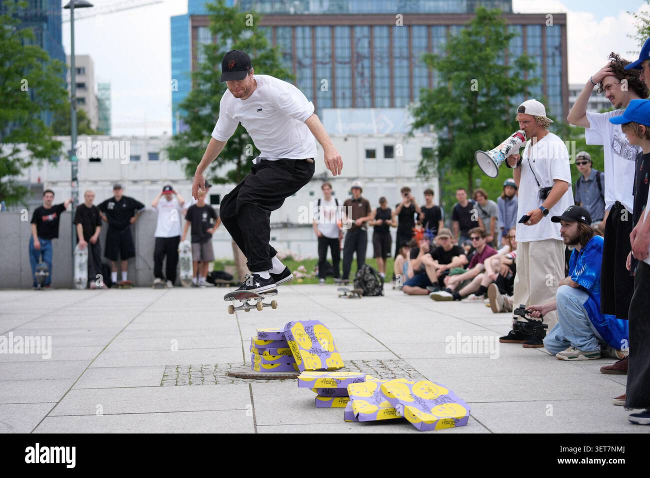 Skateboarders are seen in central Warsaw, Poland on 21 June, 2026 ...