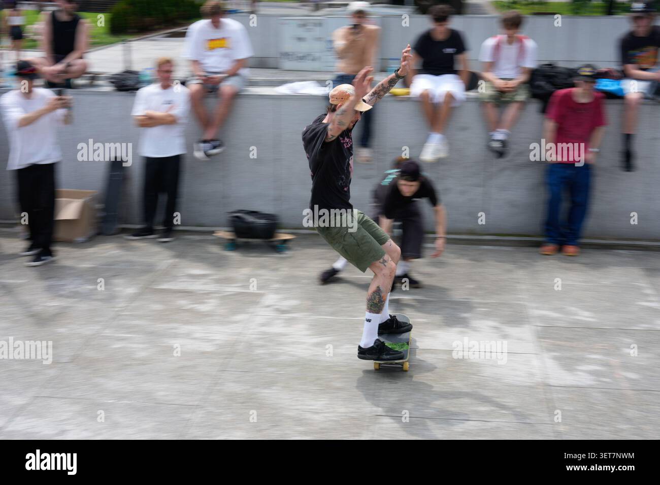 Skateboarders are seen in central Warsaw, Poland on 21 June, 2026 ...