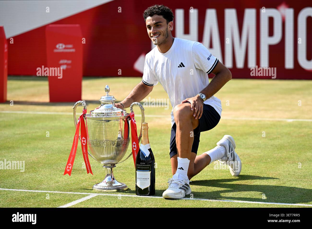 Francisco Cerundolo of Argentina poses with the trophy after winning ...
