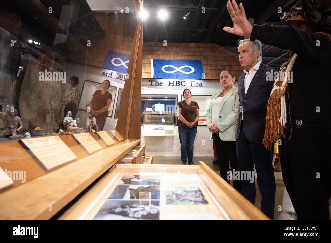 Snueymuxw Elder Bill White talks about an exhibit as Prime Minister ...