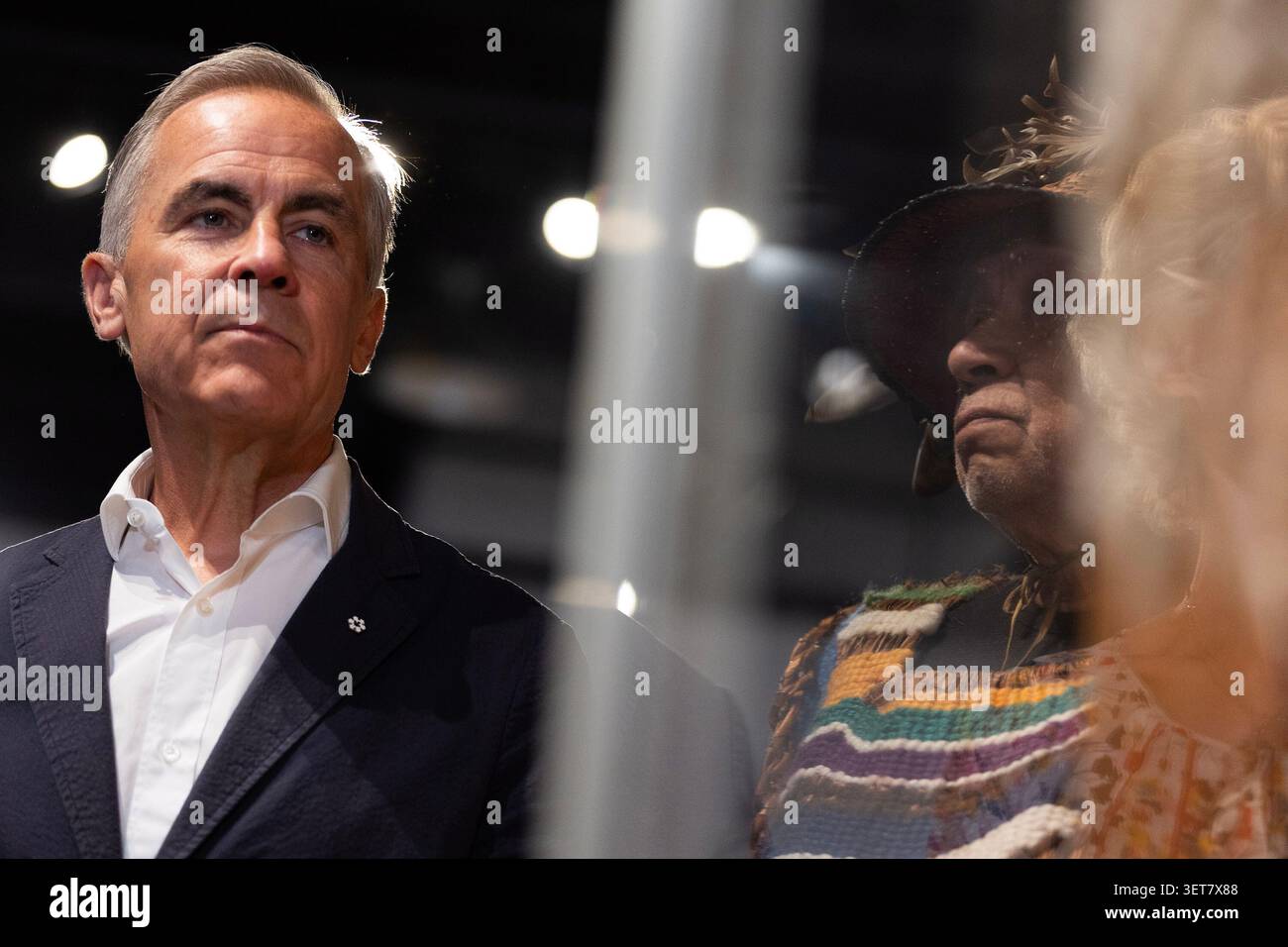 Snueymuxw Elder Bill White looks as he joins Prime Minister Mark Carney ...