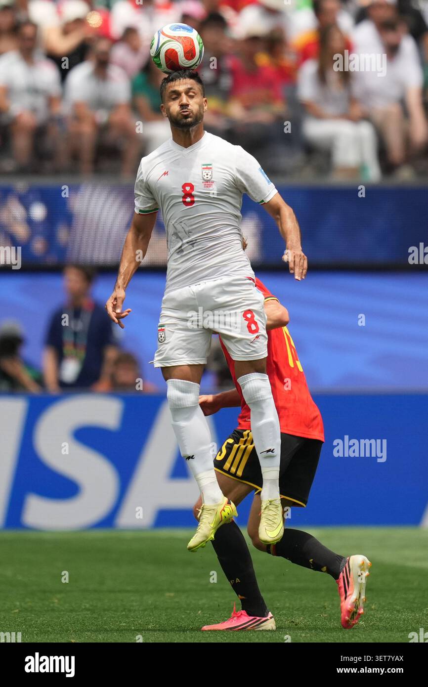Iran's Mohammad Mohebbi jumps for the ball during the World Cup Group G ...