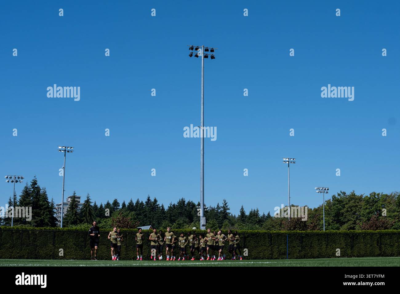 Canada players run laps during a FIFA World Cup training session, in ...