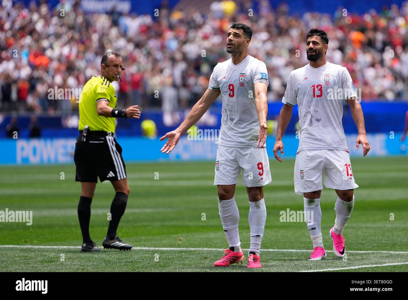 Iran's Mehdi Taremi (9) and Hossein Kanani react during the World Cup ...