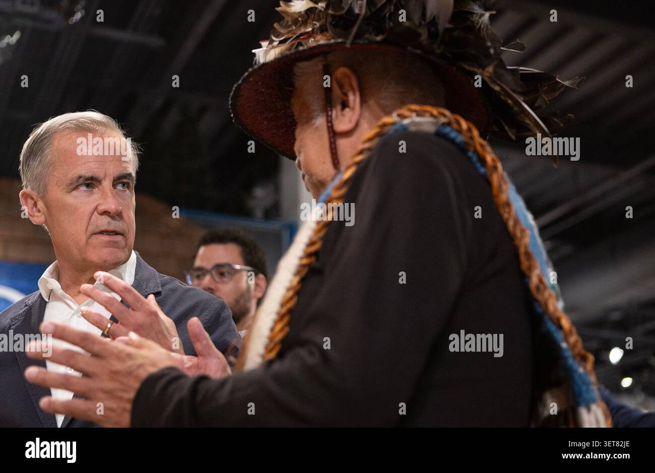 Snueymuxw Elder Bill White talks with Prime Minister Mark Carney during ...