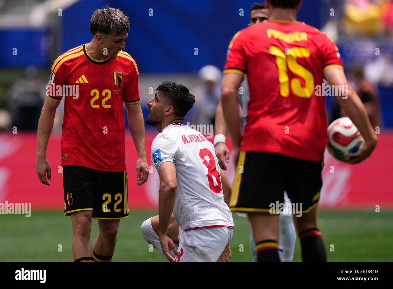 Iran's Mohammad Mohebbi (8) and Belgium's Alexis Saelemaekers (22 ...