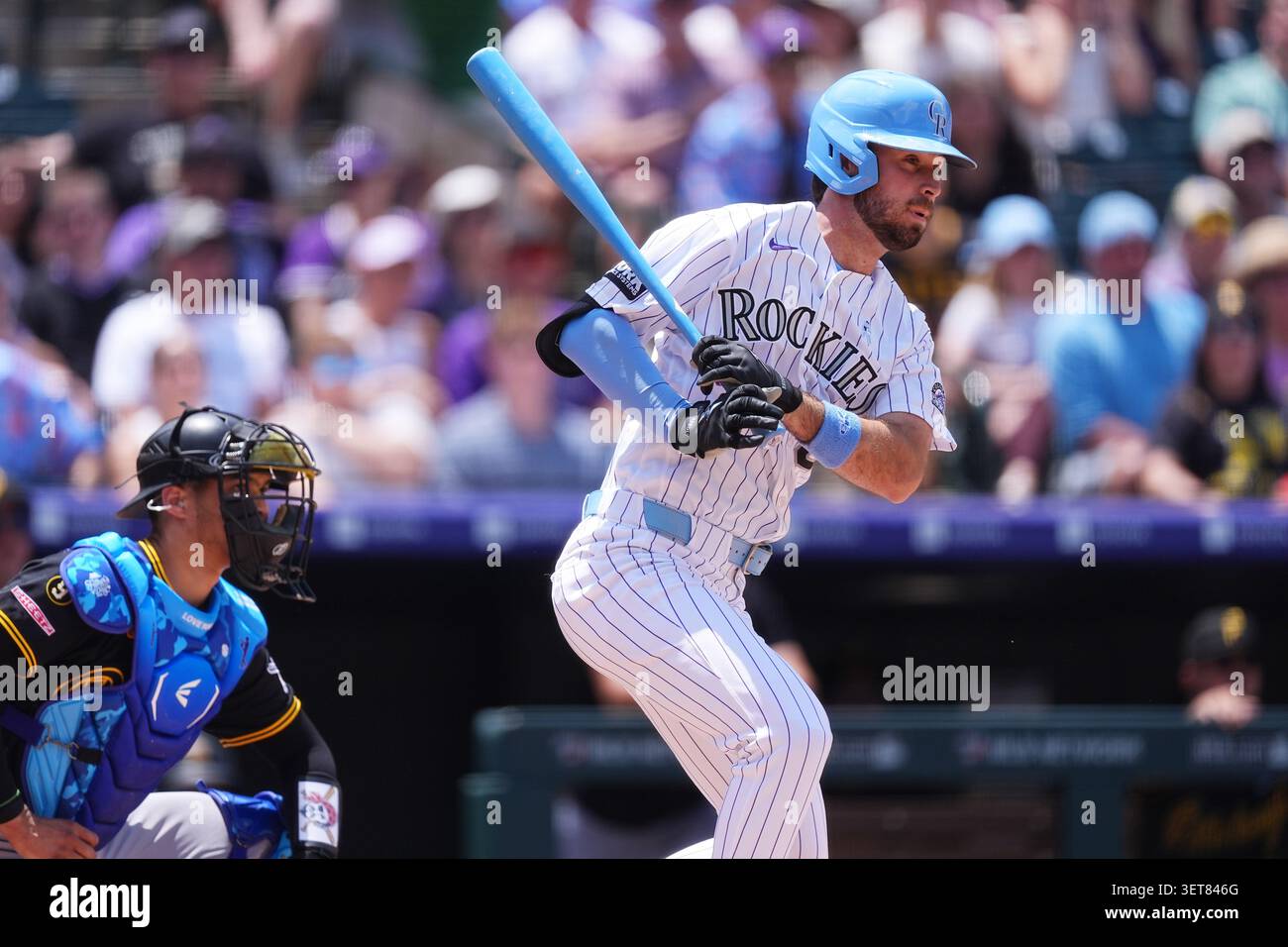 Colorado Rockies' Sterlin Thompson, right, hits an RBI ground ball off ...