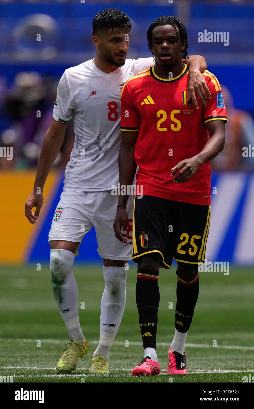 Iran's Mohammad Mohebbi, left, embraces Belgium's Nathan Ngoy at the ...