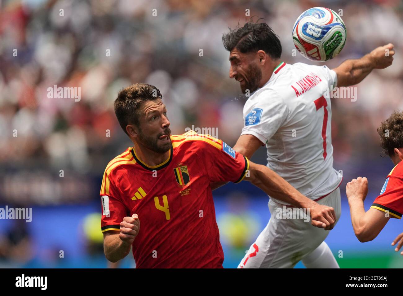 Belgium's Brandon Mechele, left, and Iran's Alireza Jahanbakhsh vie for ...