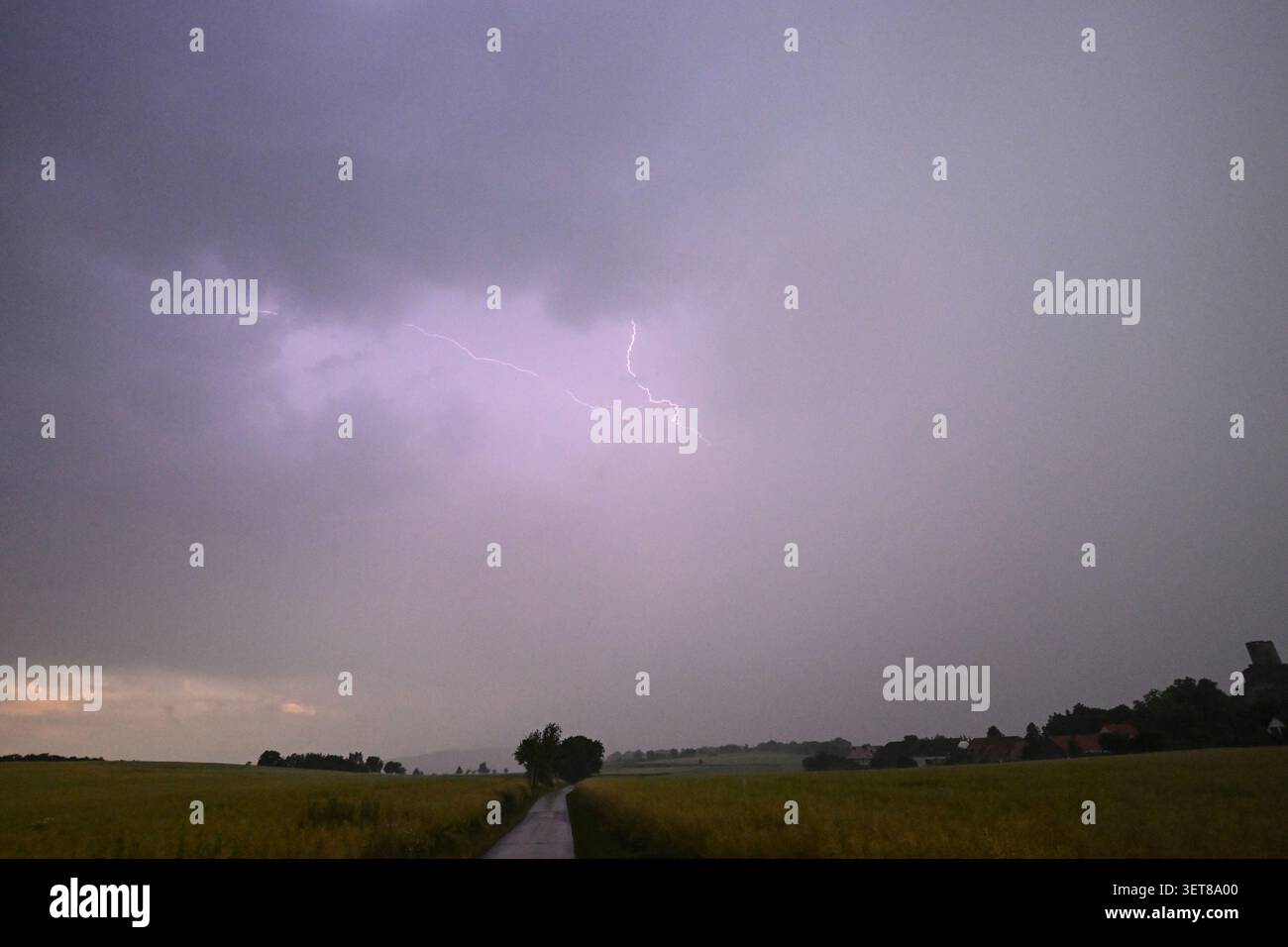 21 June 2026, Hesse, Münzenberg: A flash of lightning illuminates the ...